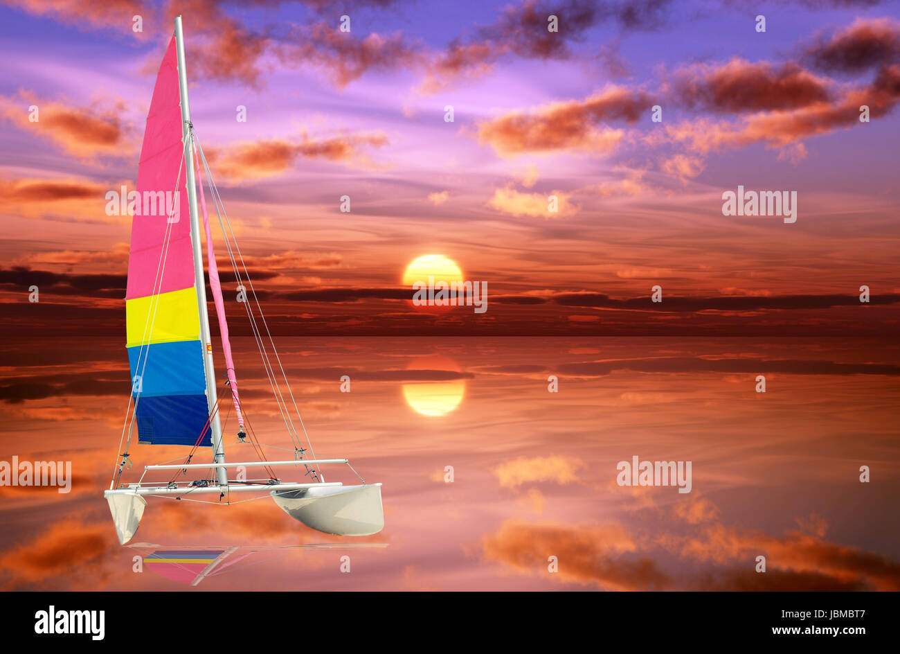Ocean sunset with boat Stock Photo - Alamy