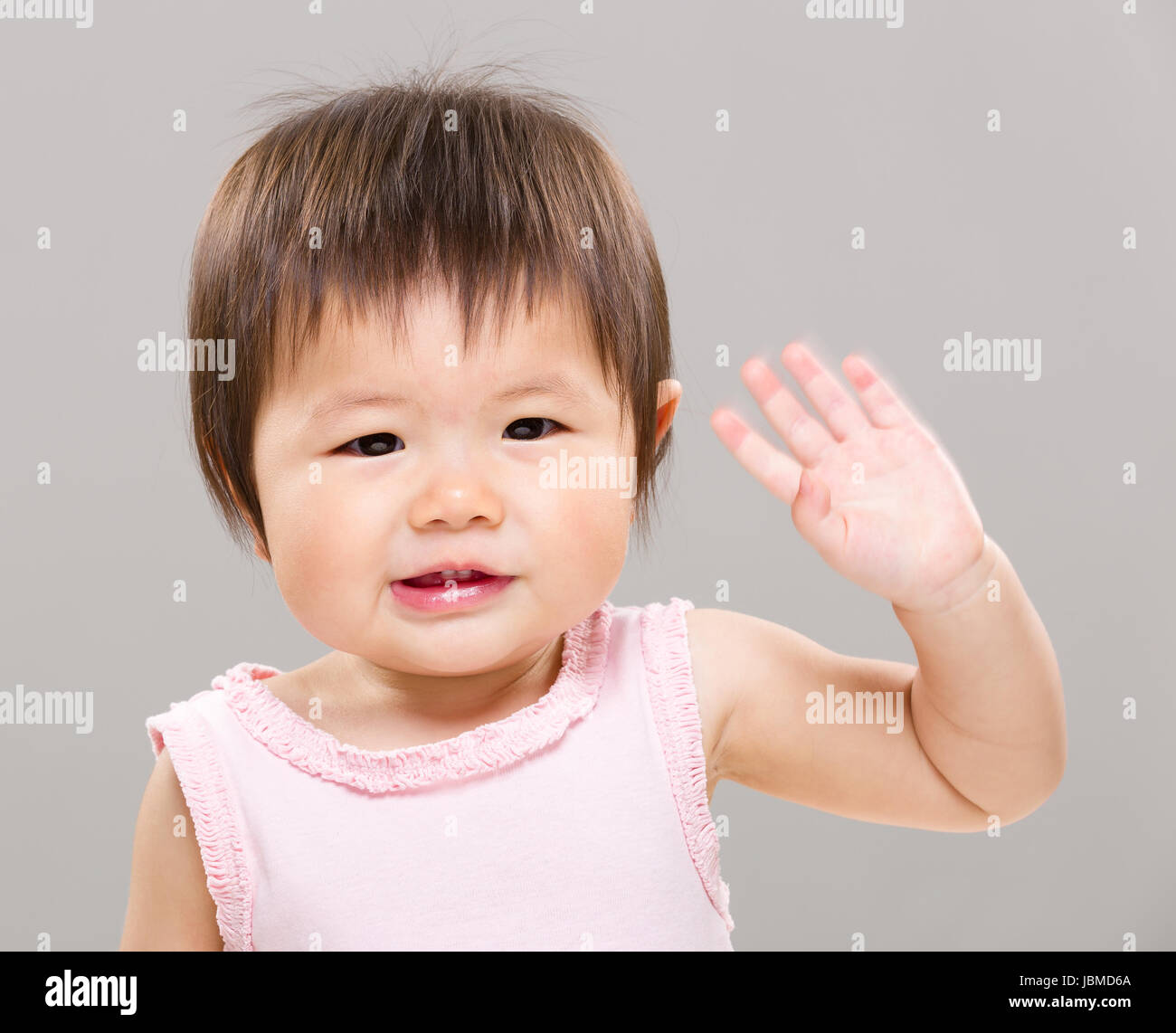 Baby girl hand up Stock Photo - Alamy
