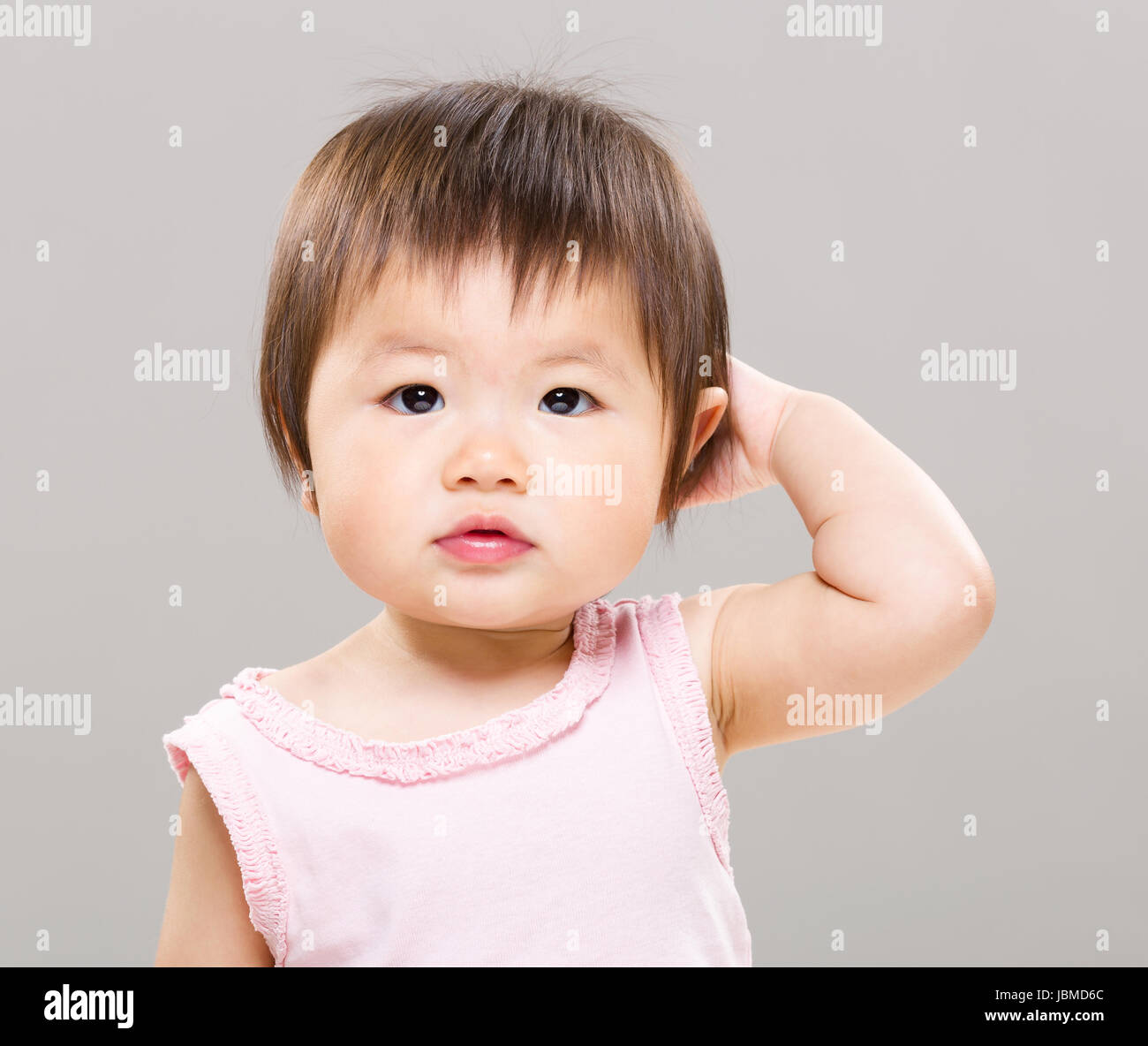 Baby feeling confused Stock Photo - Alamy