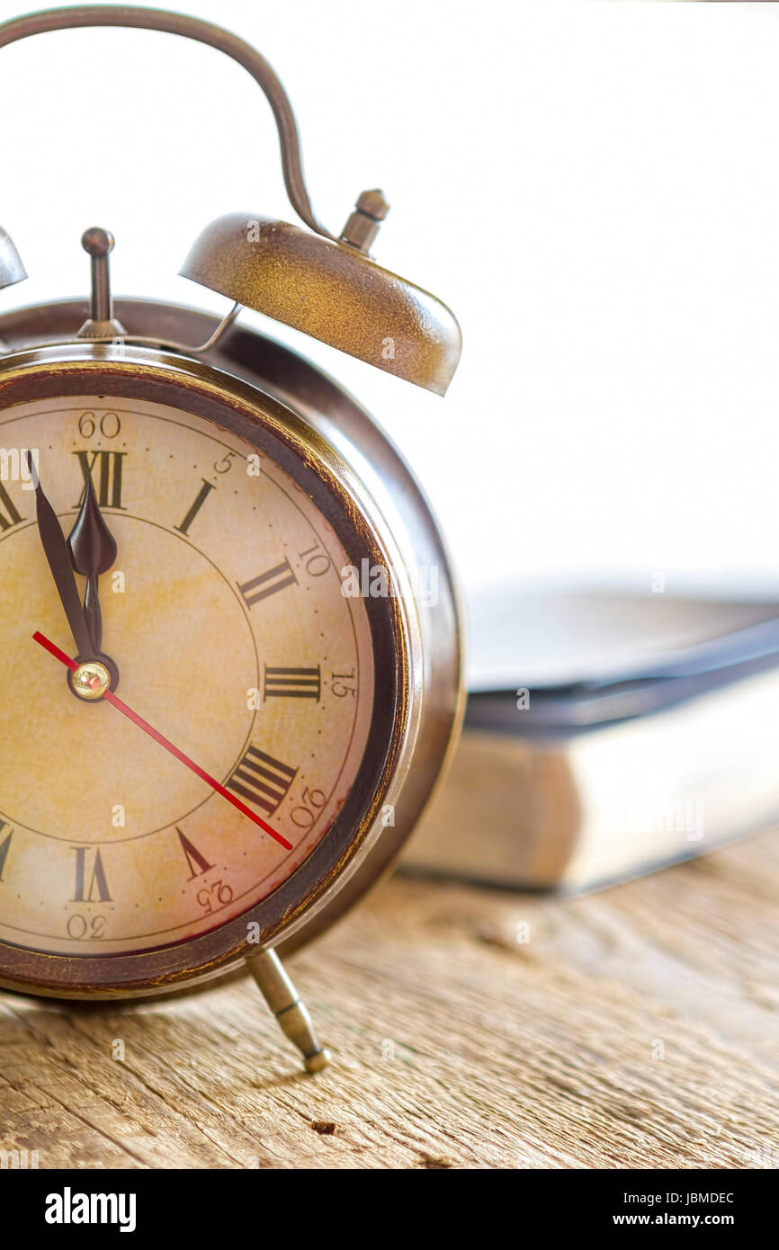 Clock and Bible on wood. Concept of clock showing a few minutes to ...