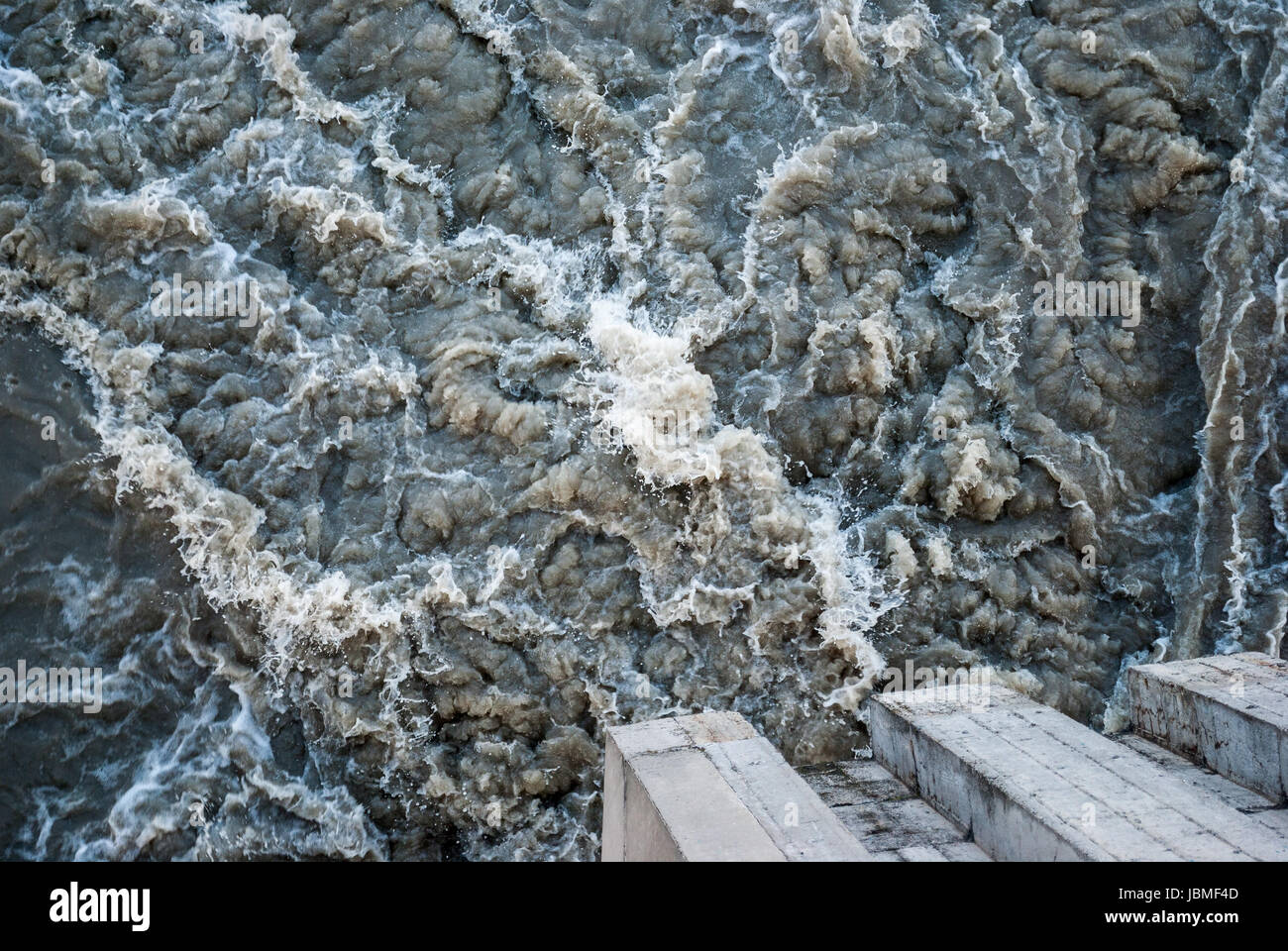 raging river during the flood and pillar of the bridge Stock Photo - Alamy
