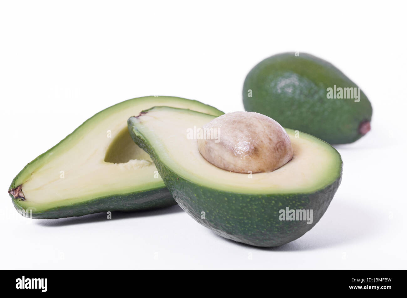 Avocado and half avocado with kernels hi-res stock photography and ...