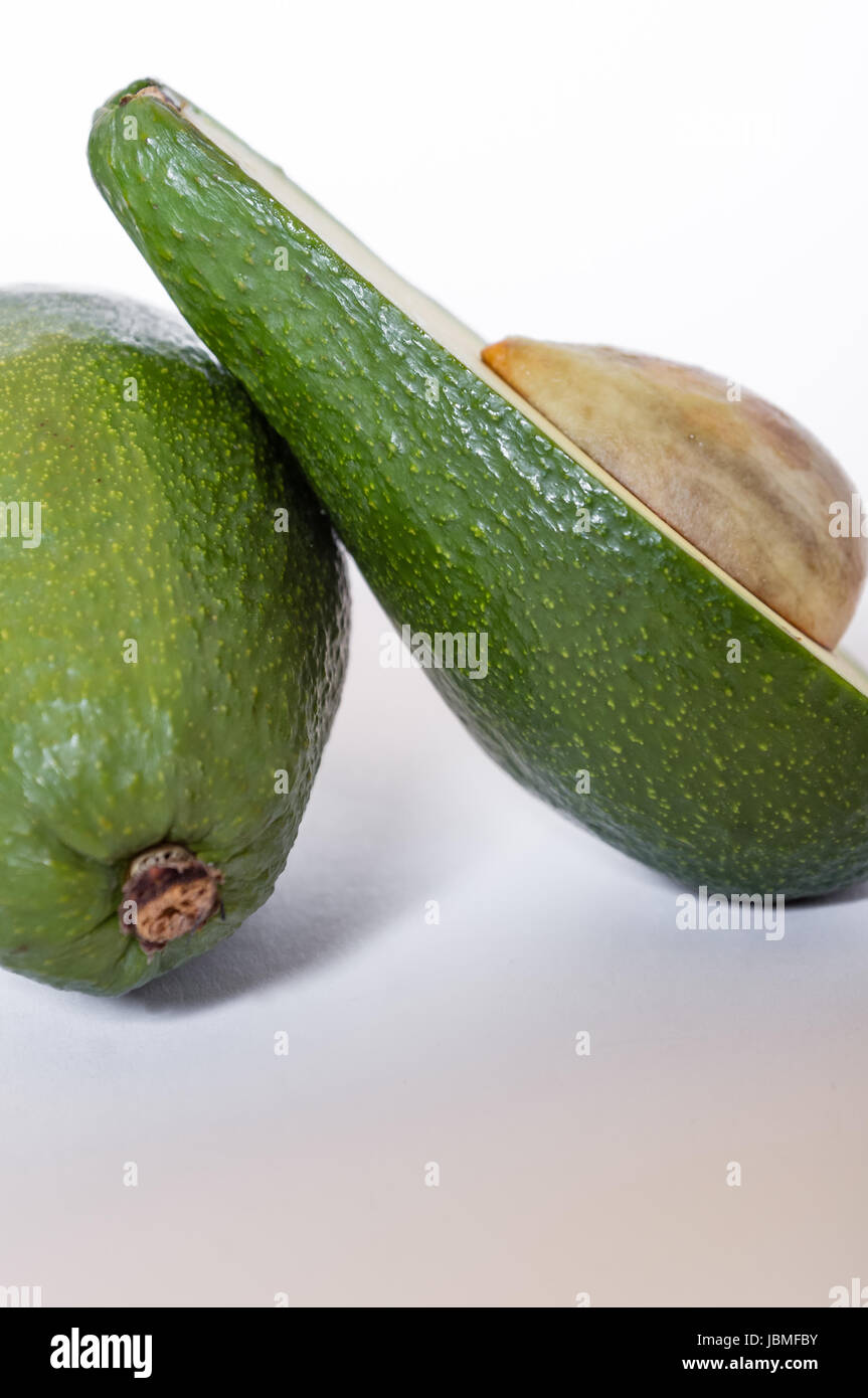 Avocado and half avocado with kernels hi-res stock photography and ...