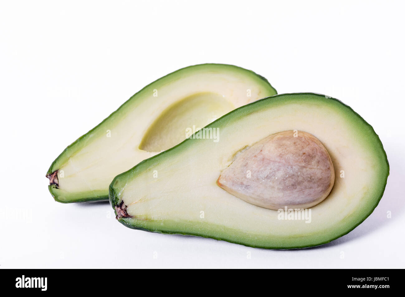 Avocado and half avocado with kernels hi-res stock photography and ...