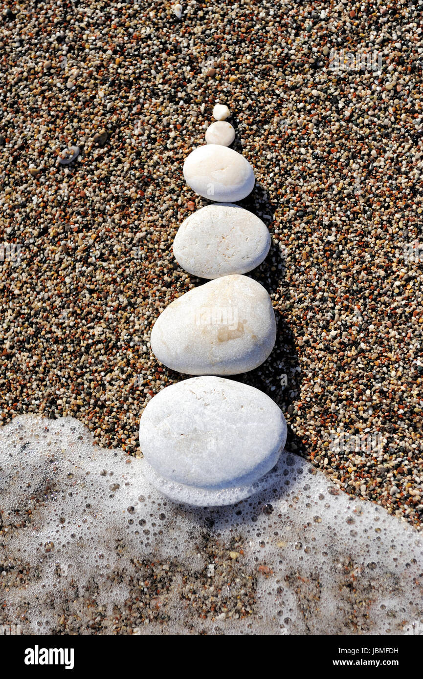 Stack of pebble stones at the beach Stock Photo - Alamy