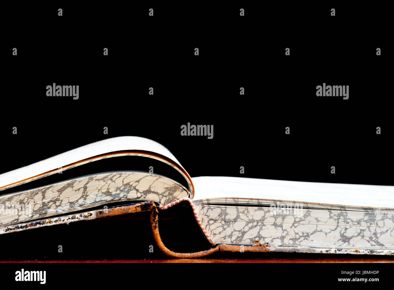 Detail of the open old book - a fount of knowledge Stock Photo - Alamy