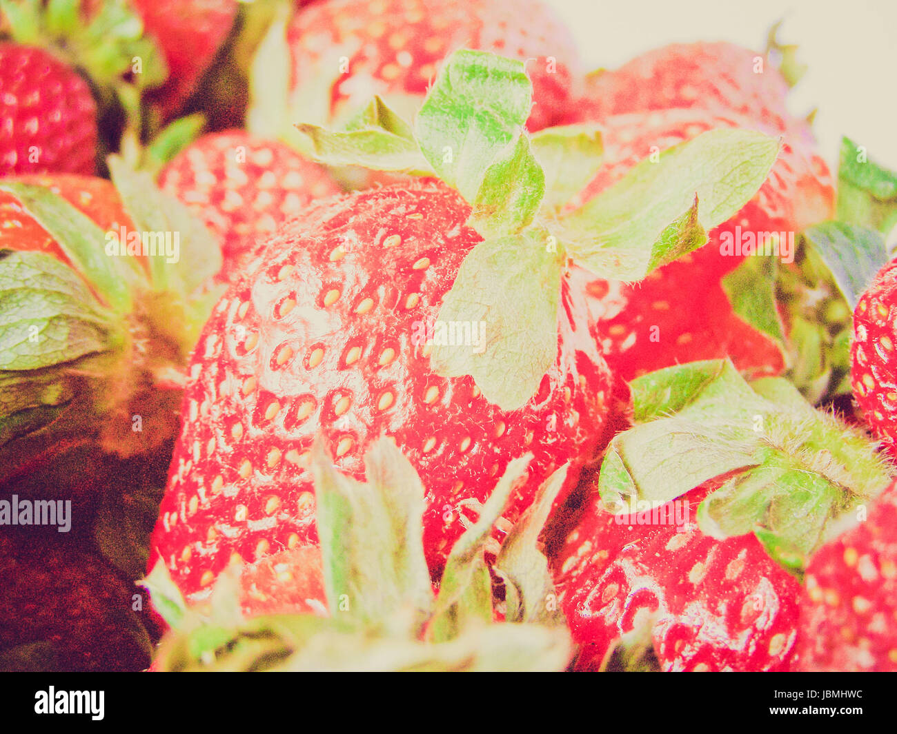 Vintage retro looking Strawberries fruits isolated over a white ...