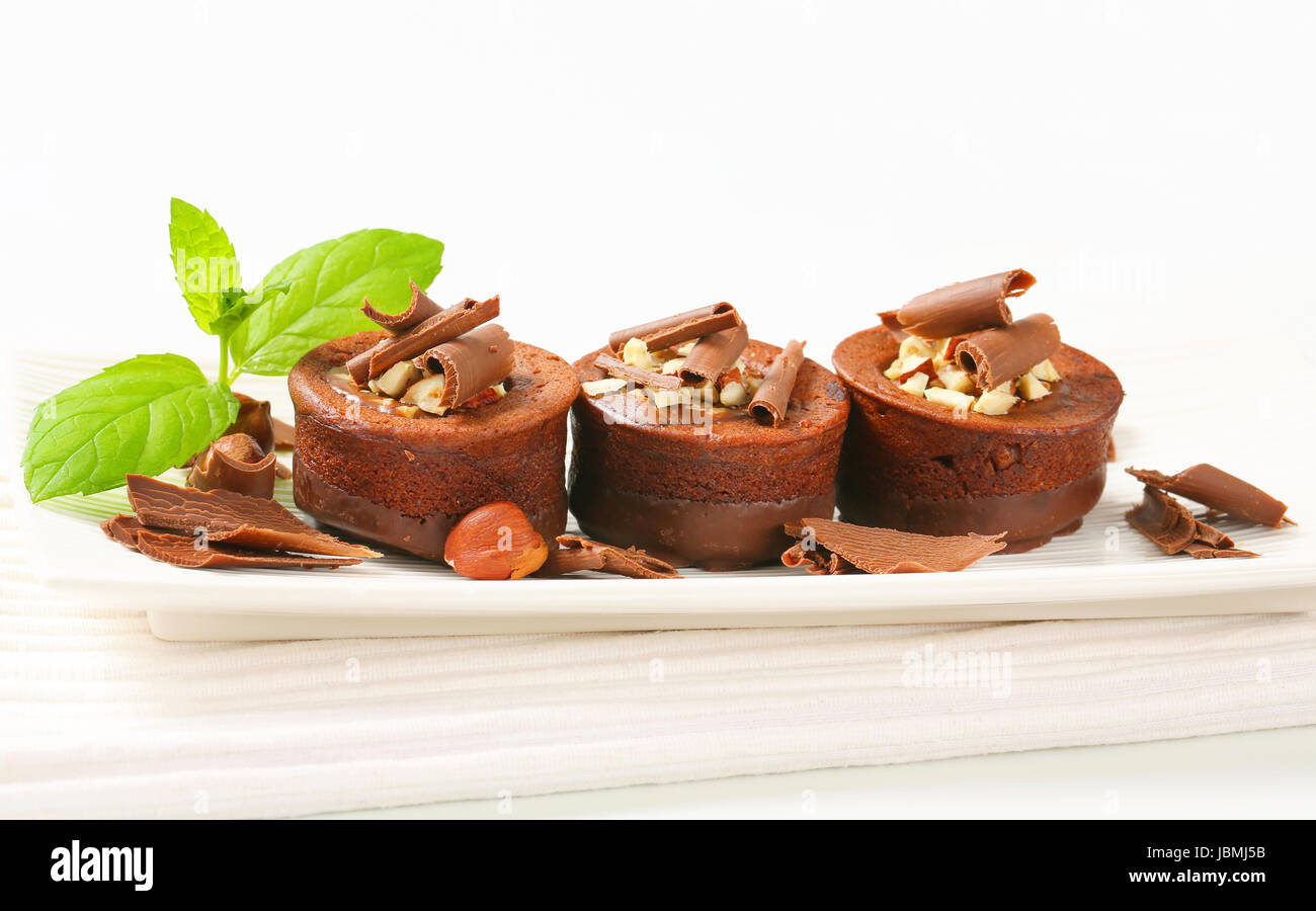 Mini chocolate cakes with hazelnut filling Stock Photo - Alamy