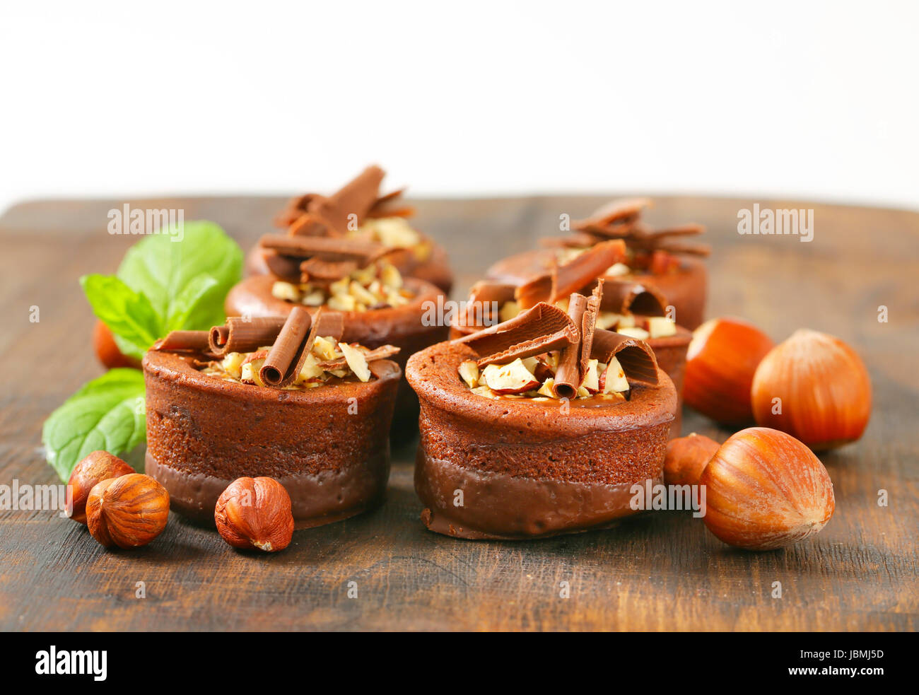 Mini chocolate cakes with hazelnut filling Stock Photo - Alamy