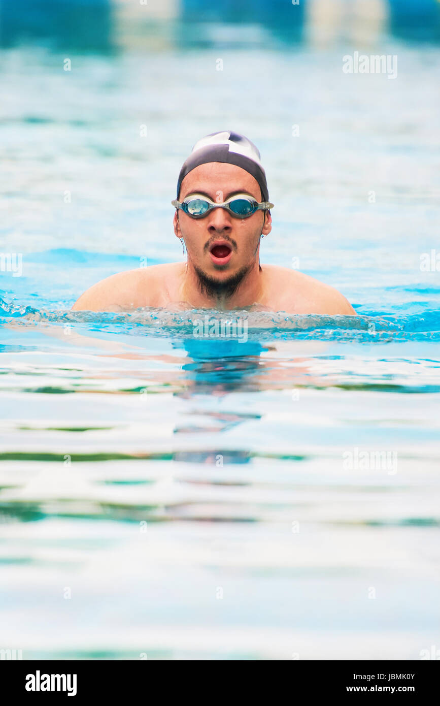Man exercise in swimming pool in vertical orientation Stock Photo - Alamy