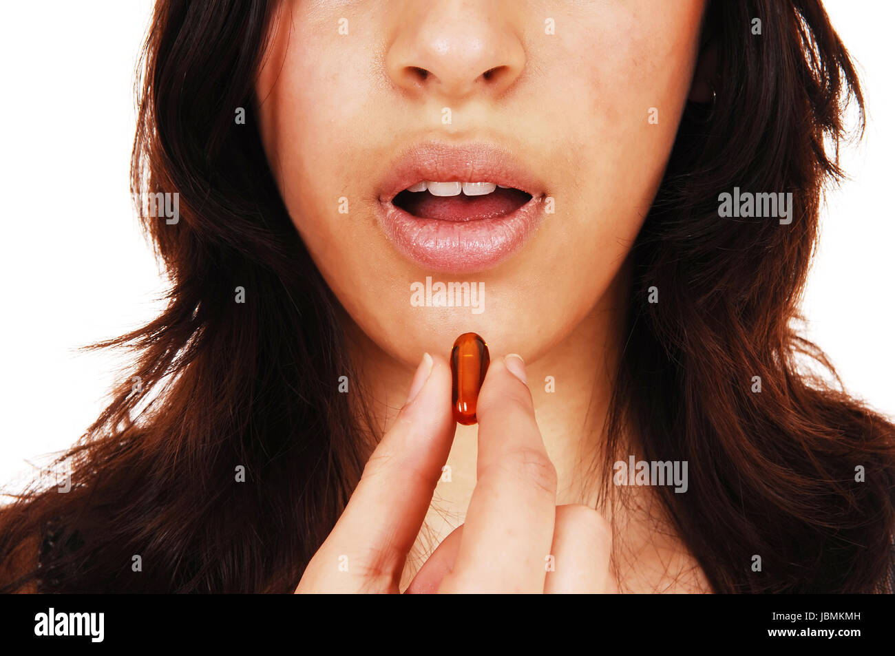 A closeup picture of the face on a young woman with an open mouth ...
