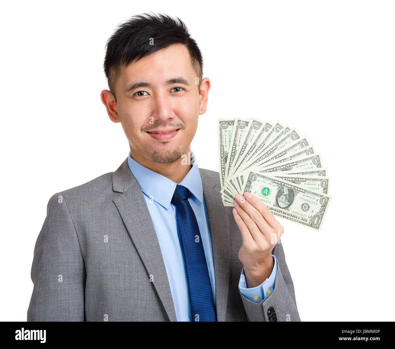 Businessman holding spread of money Stock Photo - Alamy