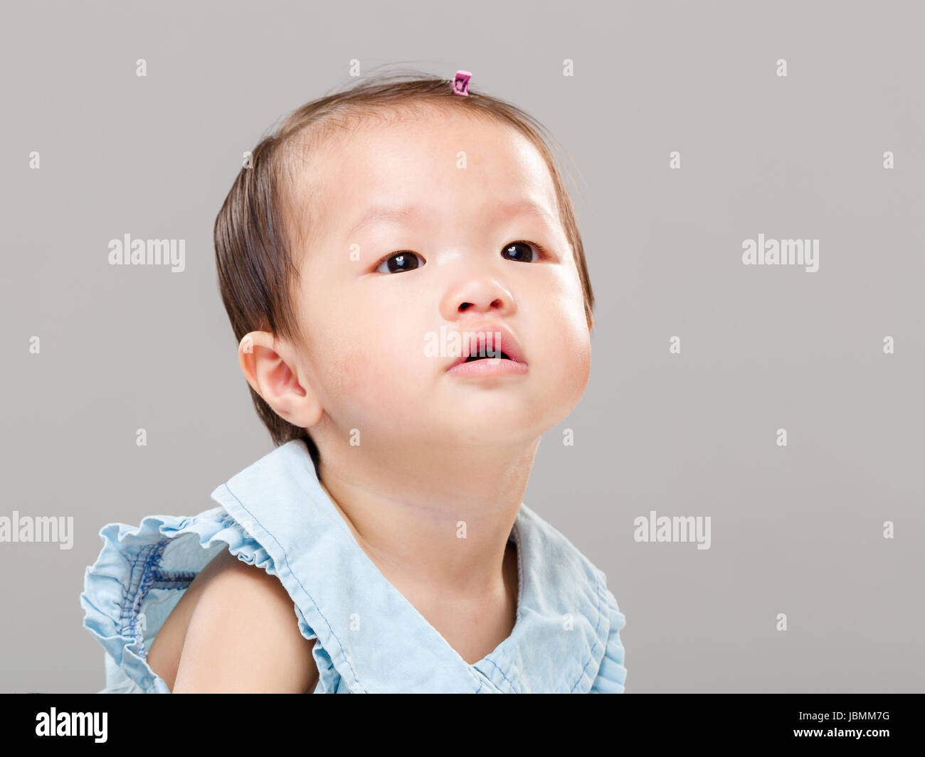 Baby looking up Stock Photo - Alamy