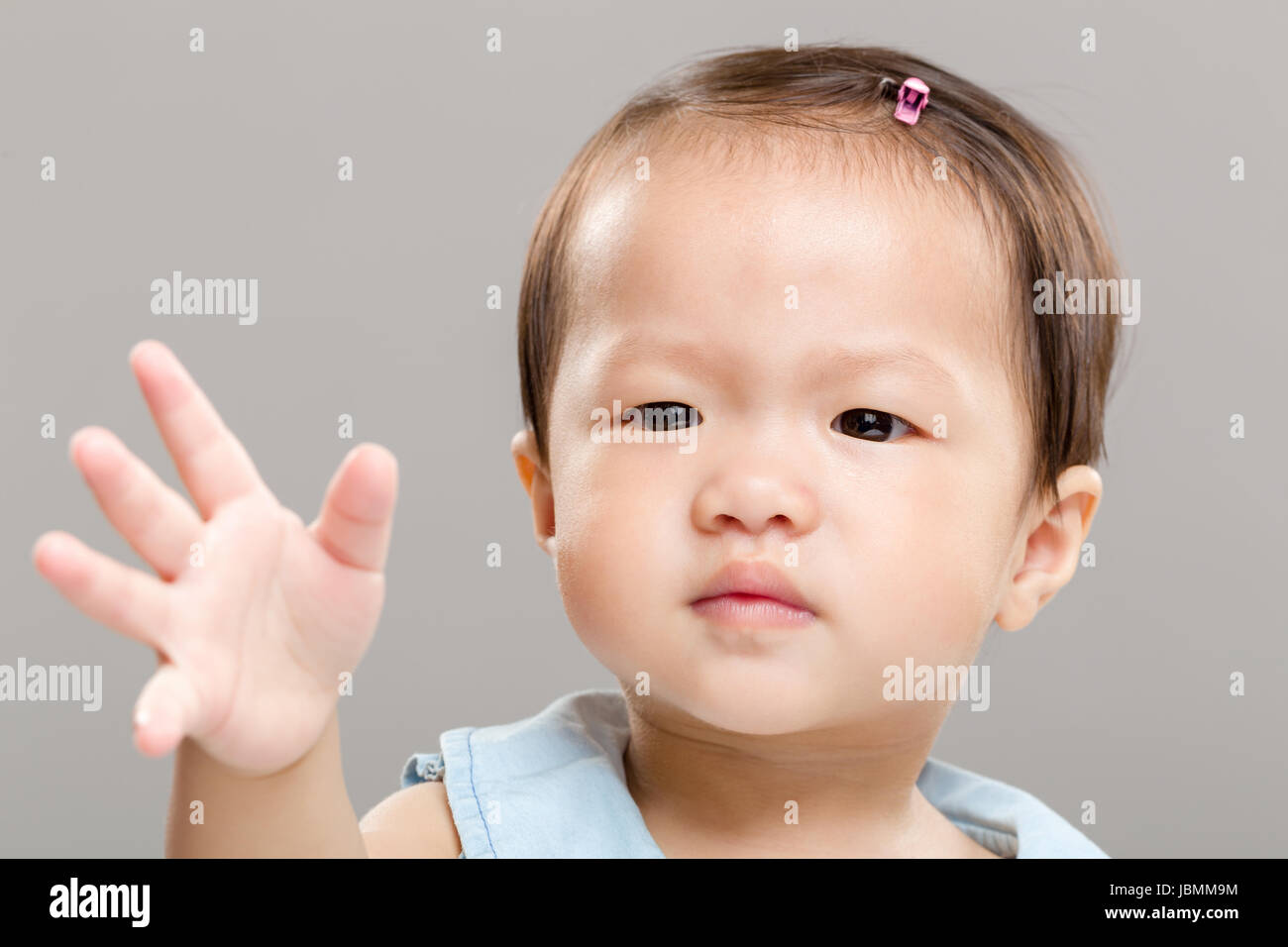 Little girl hand up Stock Photo - Alamy
