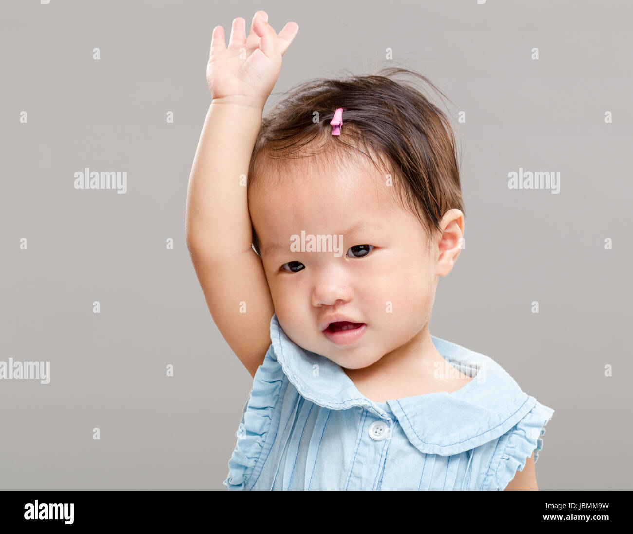 Little girl hand raise up Stock Photo - Alamy