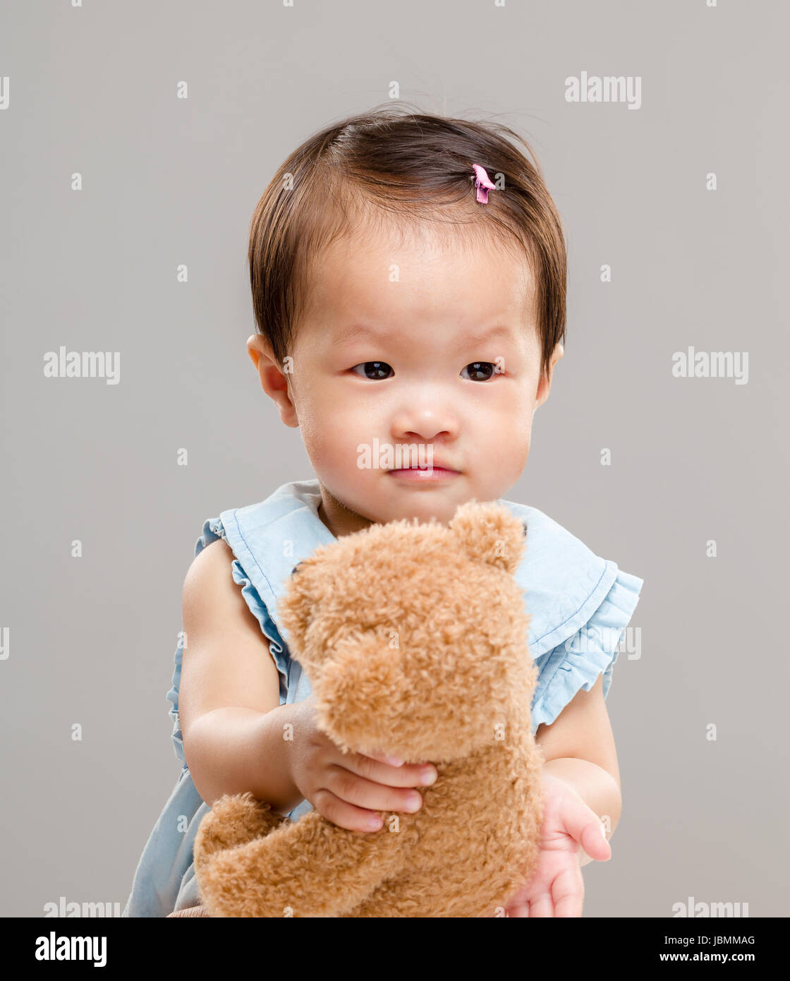 Baby girl with bear Stock Photo - Alamy