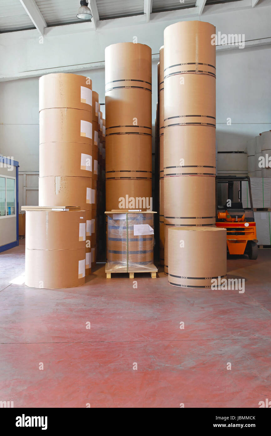 Big pile of printing paper rolls in warehouse Stock Photo - Alamy