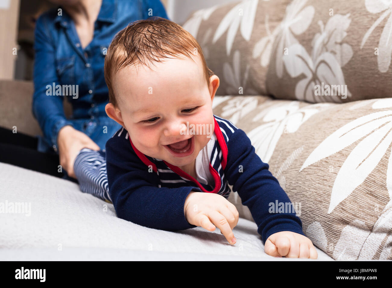 Happy baby boy laughing and having fun Stock Photo - Alamy