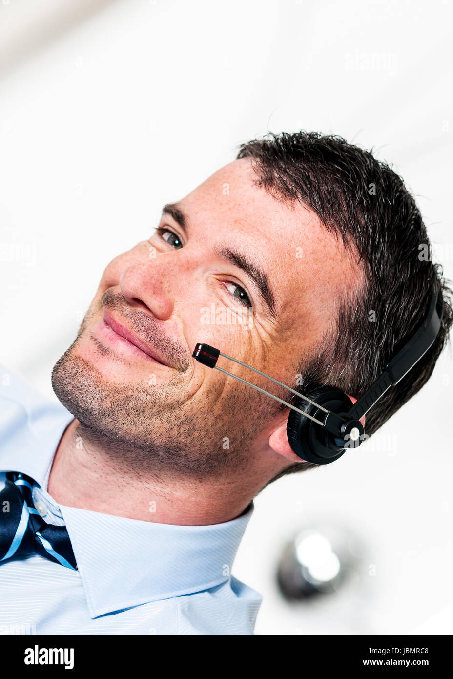 beautiful man is calling by headphone Stock Photo - Alamy