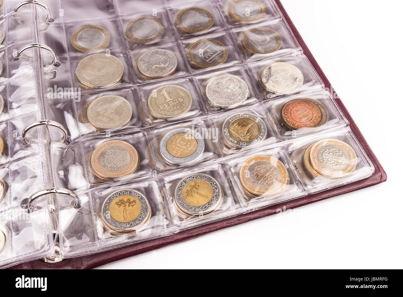 Coin album with world coins Stock Photo - Alamy