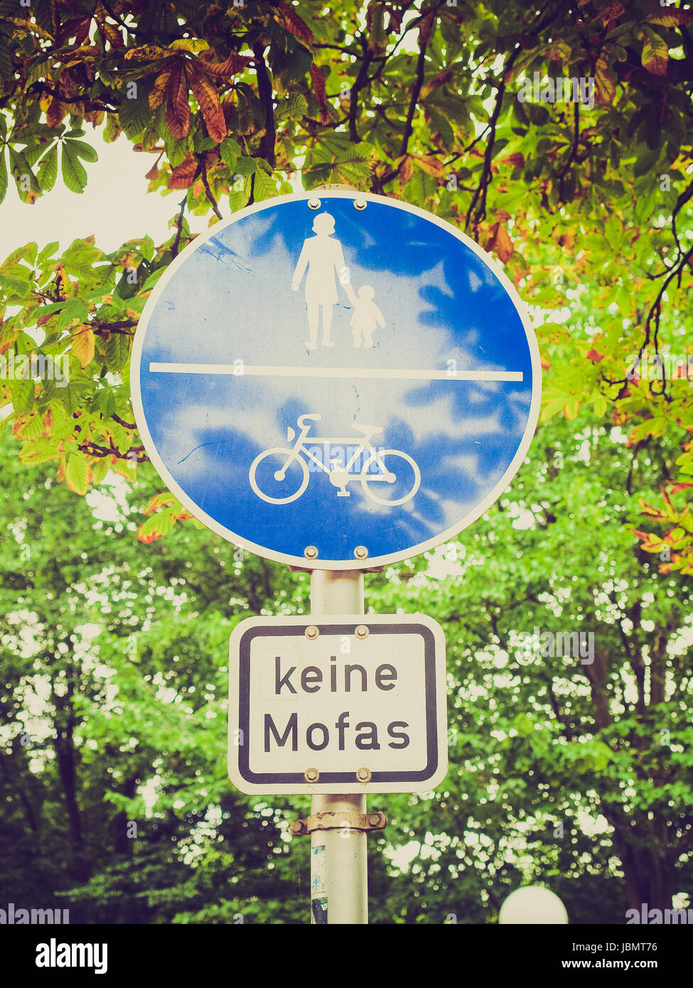 Vintage retro looking A road sign for a pedestrian zone and bike lane ...