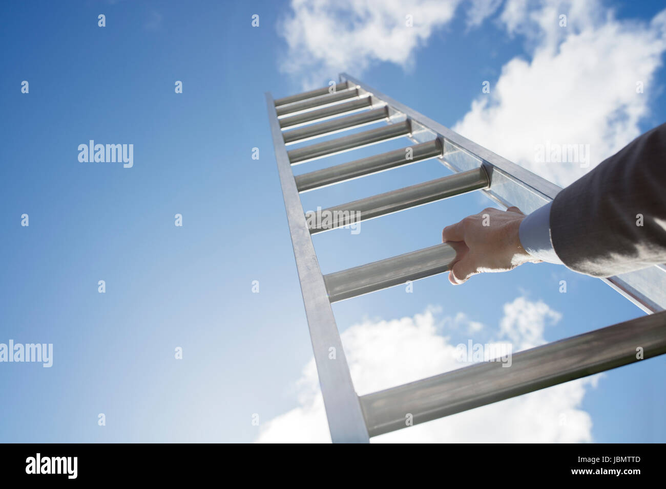 Businessman climbing the corporate ladder of success Stock Photo - Alamy