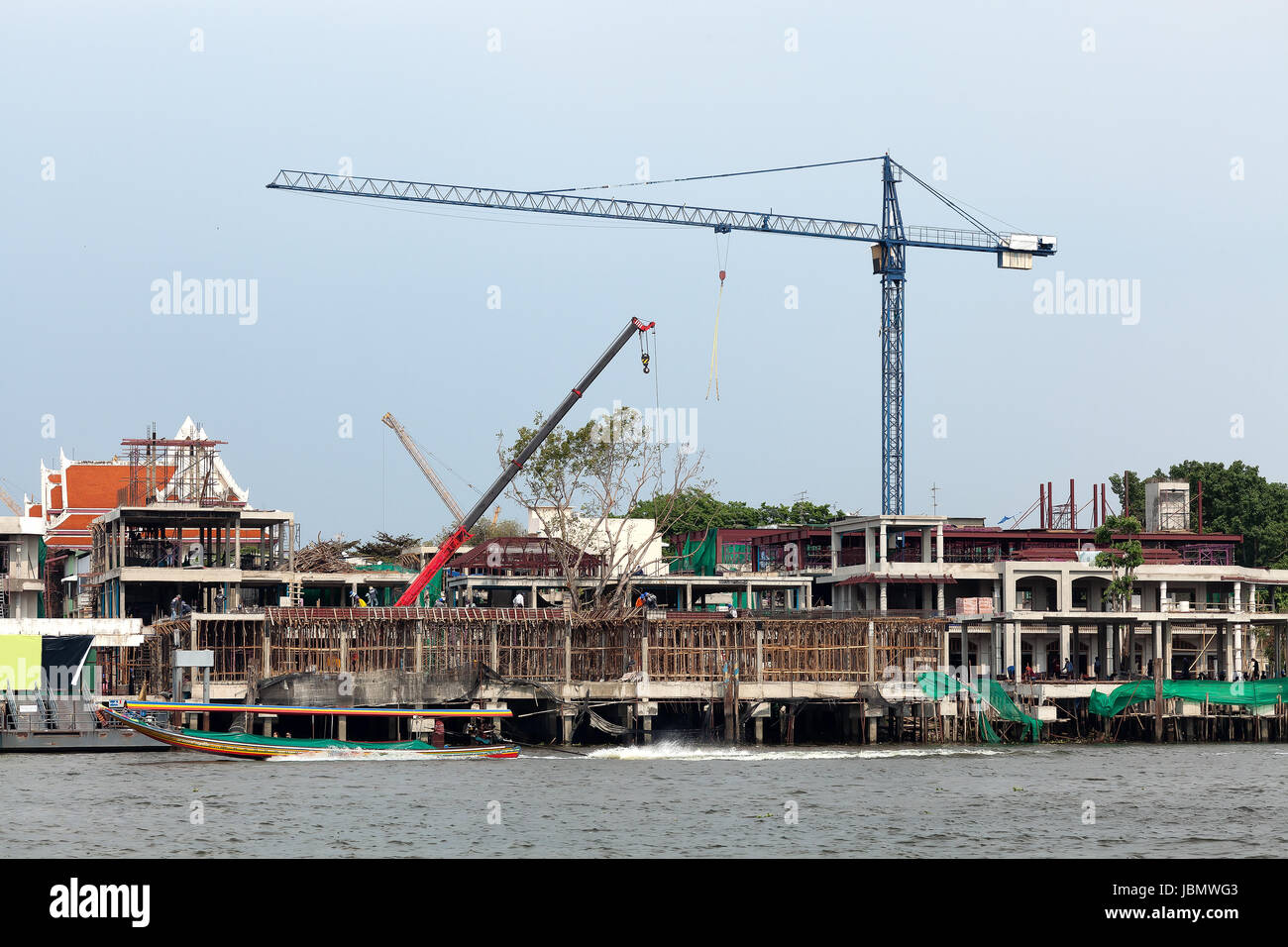 Riverside building construction Stock Photo - Alamy