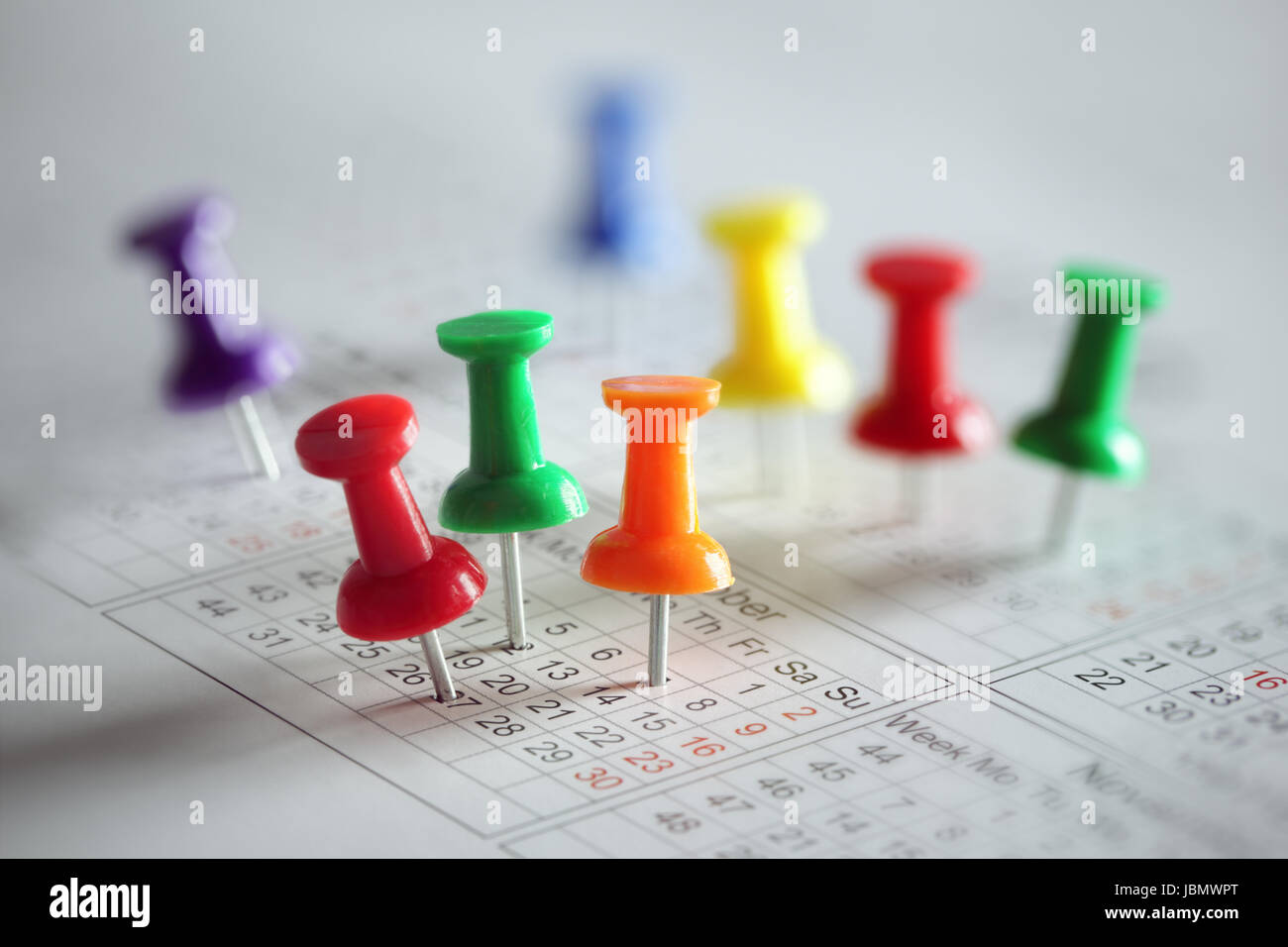 Thumbtack in calendar concept for busy, appointment and meeting ...