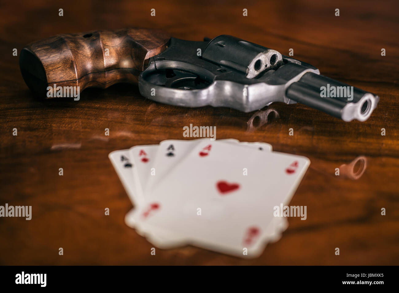 Gun playing cards hi-res stock photography and images - Alamy