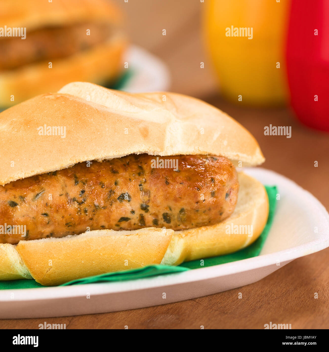 Fried bratwurst in bun, traditional German fast food served on ...