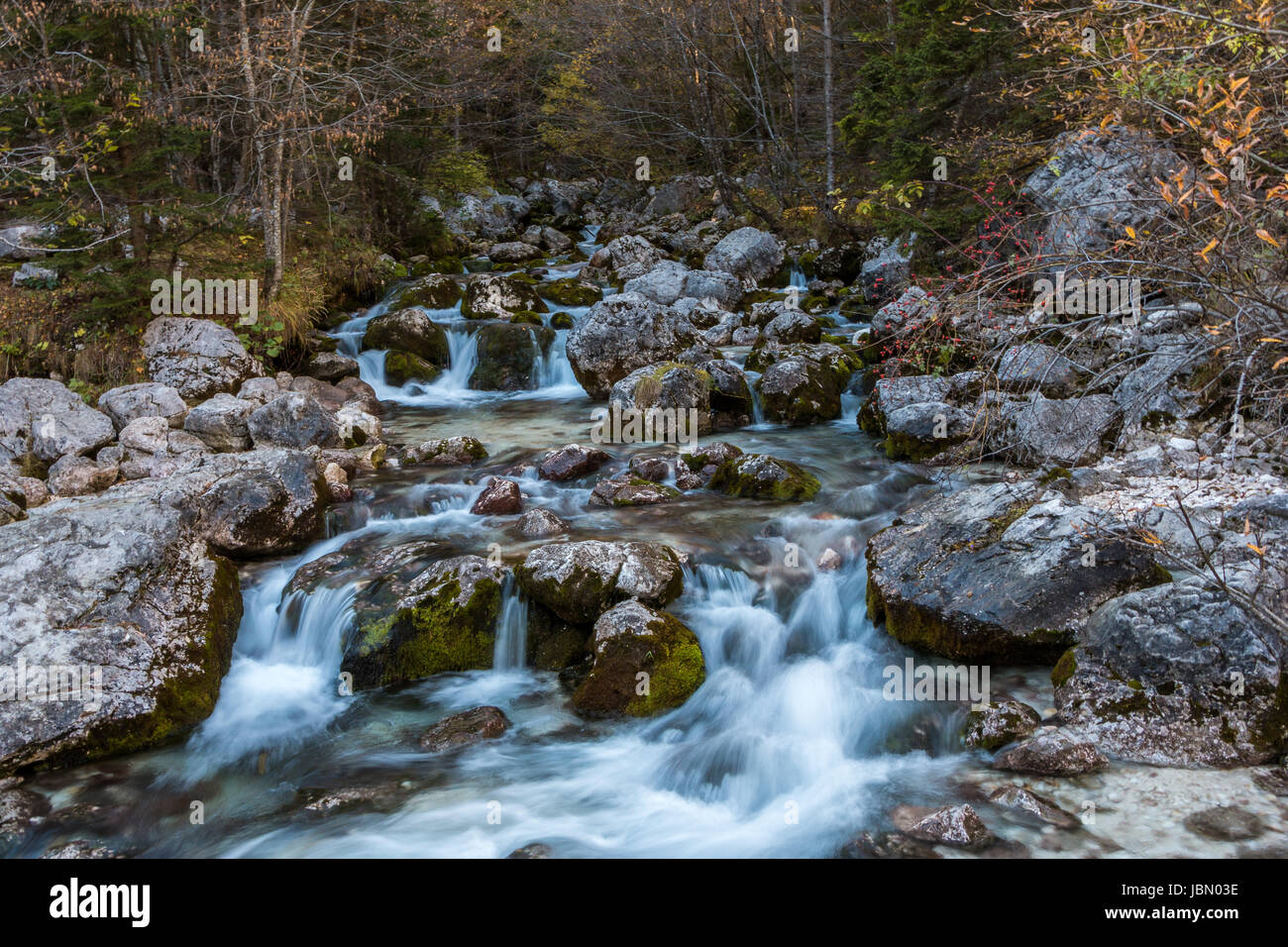 The Soca / Isonzo River near the source flowing over rocks Stock Photo ...