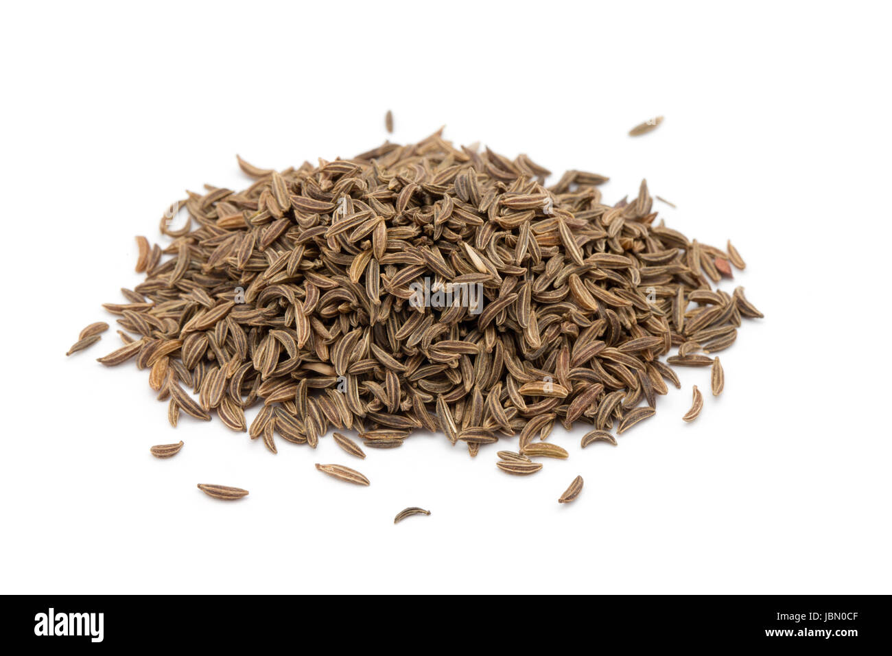 Pile of cumin seeds isolated on white background Stock Photo - Alamy