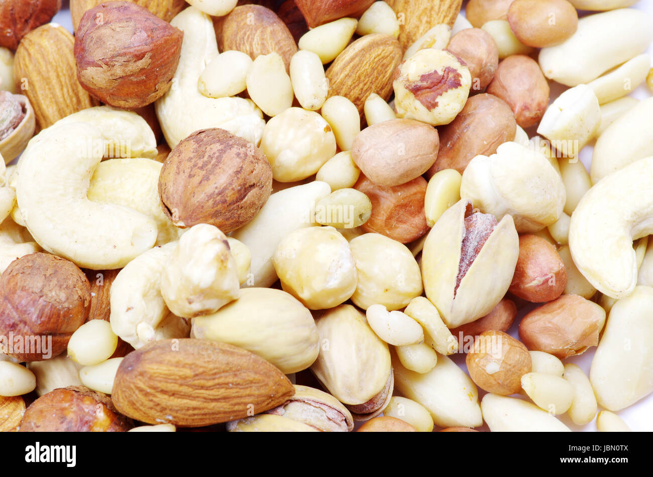 various nuts on a background Stock Photo - Alamy