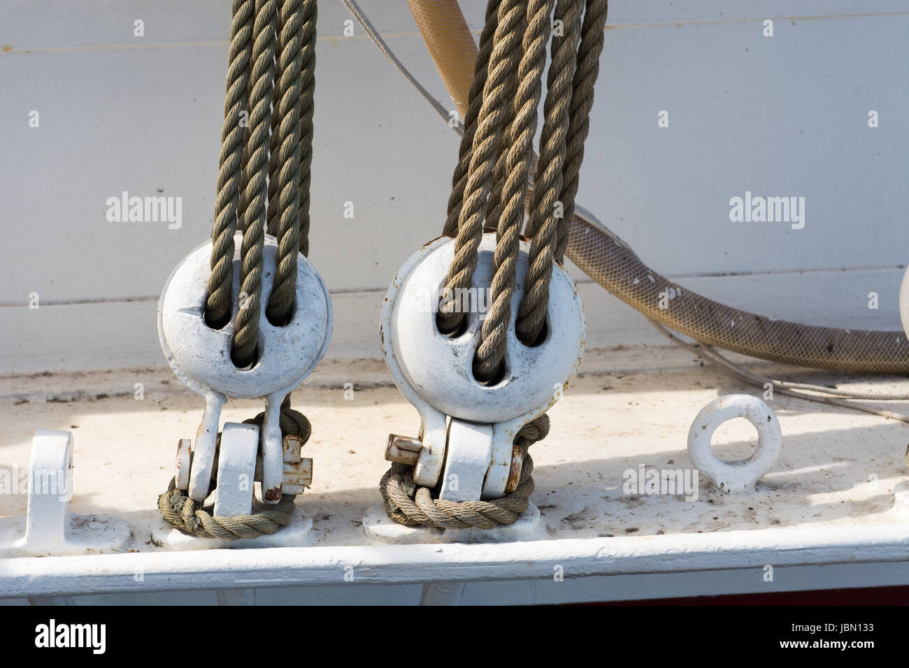 Detail of wooden block tackle marine rigs and ropes Stock Photo - Alamy