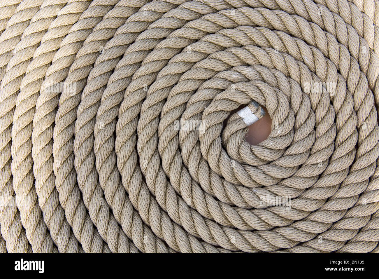 Roll of a rough strong ship rope background pattern Stock Photo - Alamy
