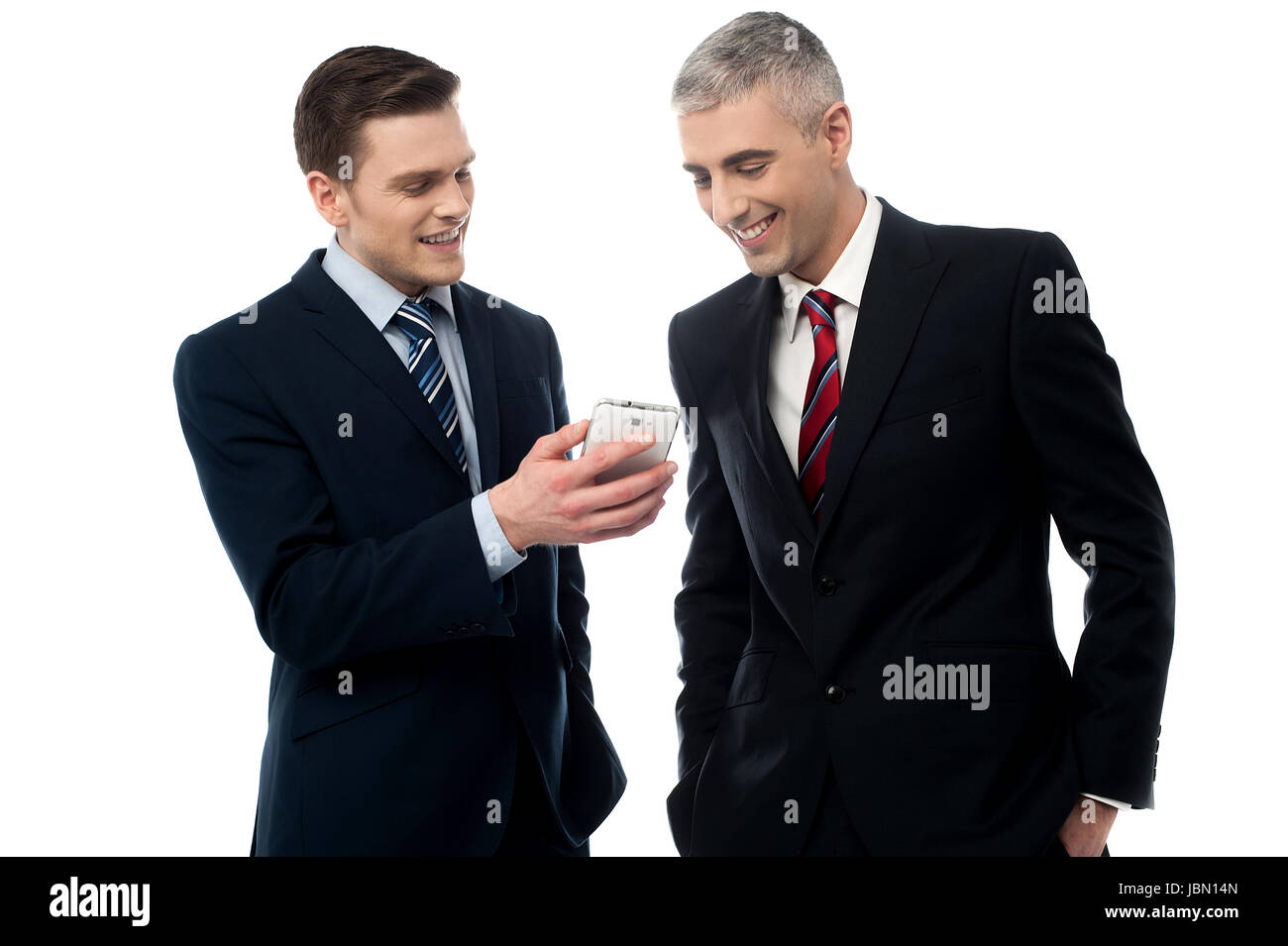 Handsome businessmen looking at smart phone Stock Photo - Alamy