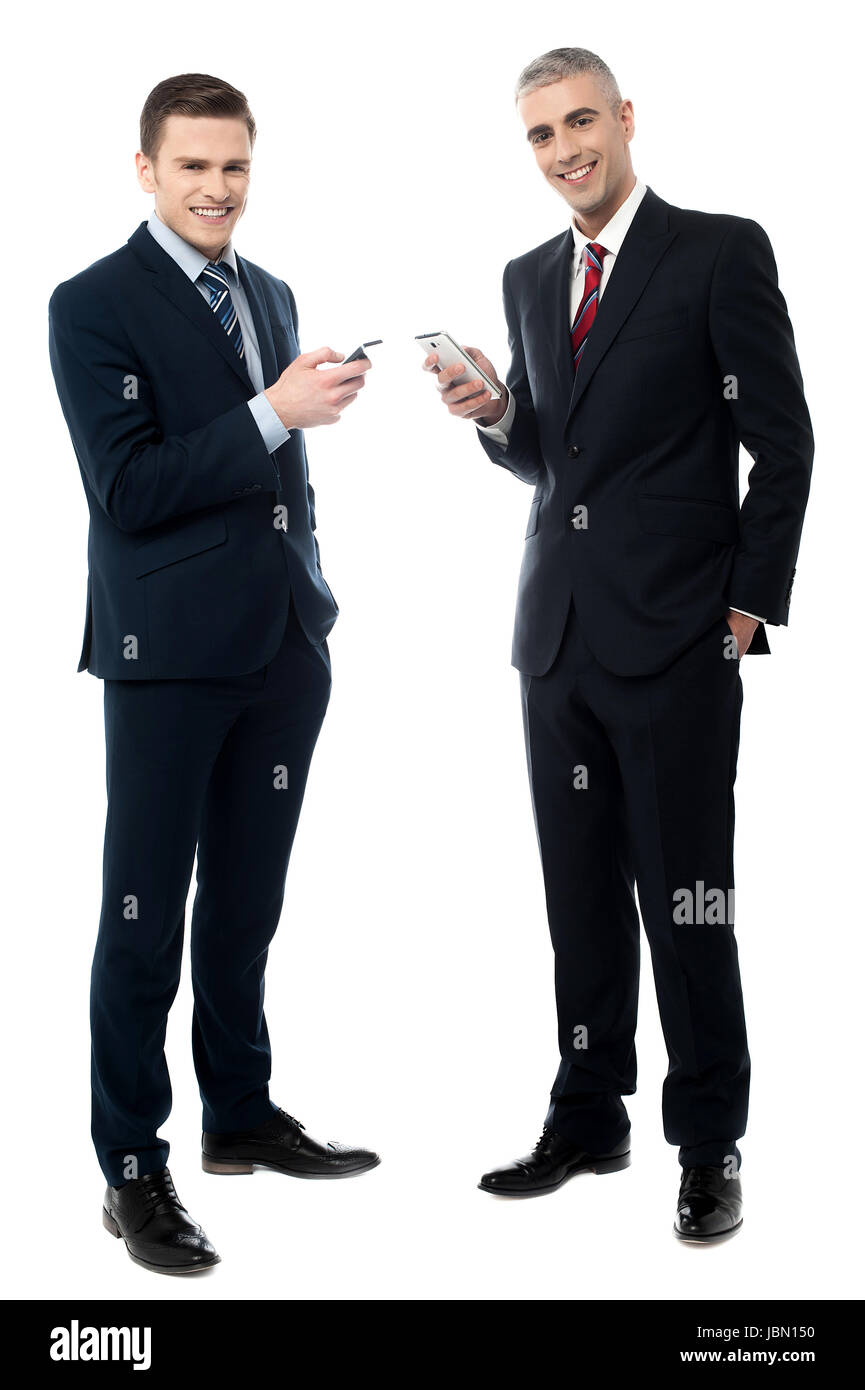 Young business people sharing their mobile numbers Stock Photo - Alamy