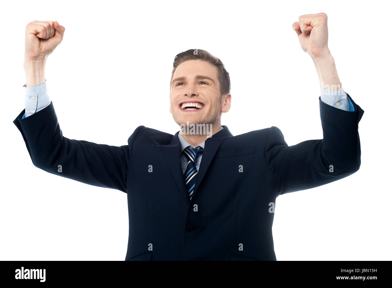 Successful businessman celebrating with arms up Stock Photo - Alamy