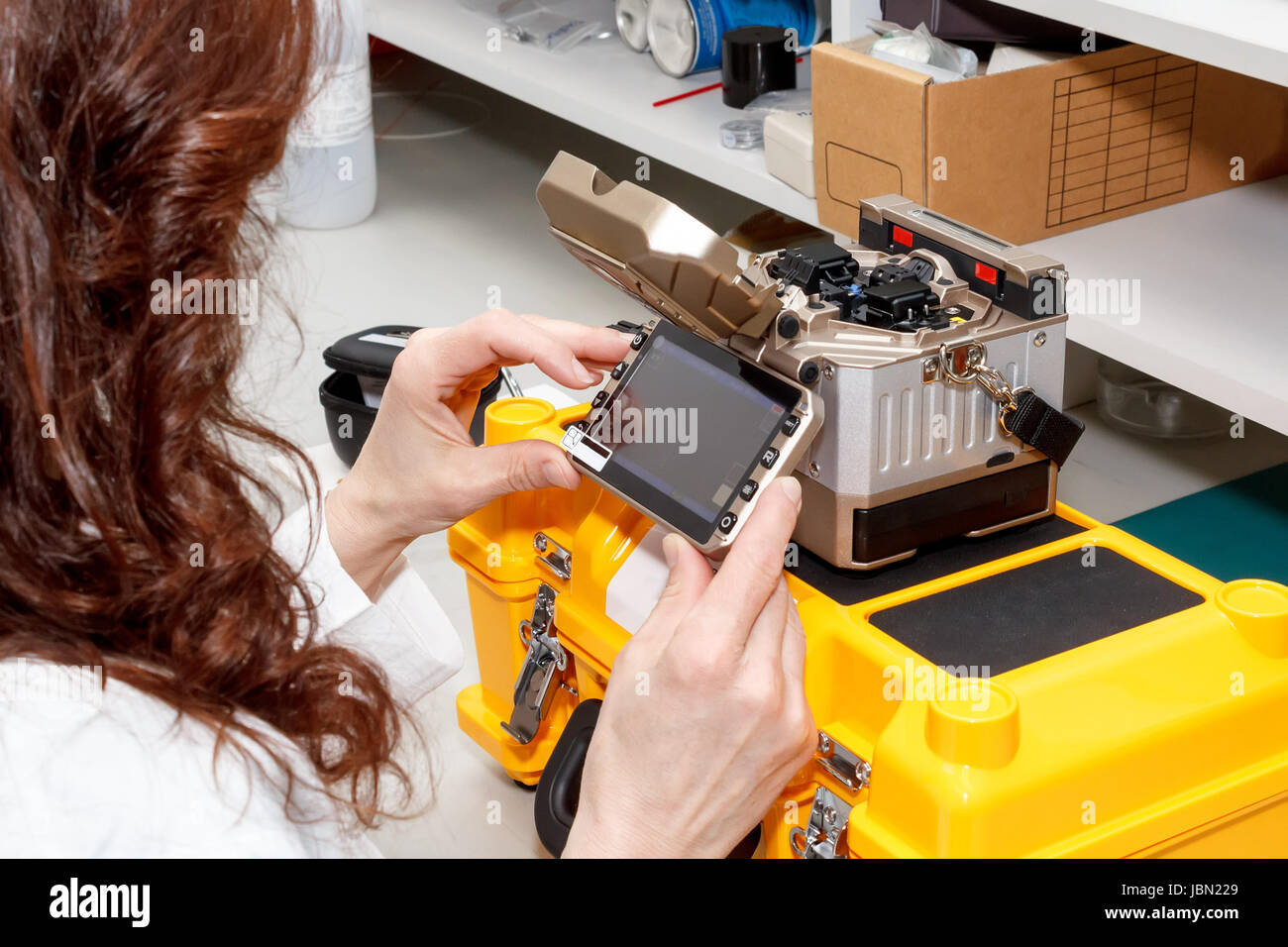 Fiber optic fusion splicer working hi-res stock photography and images ...