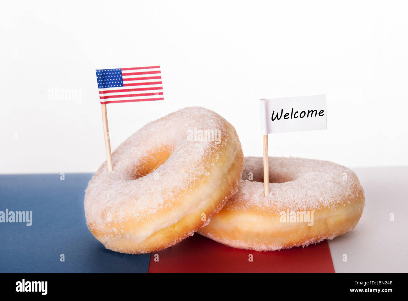 Donut with an American Flag and a Welcome Flag Stock Photo - Alamy