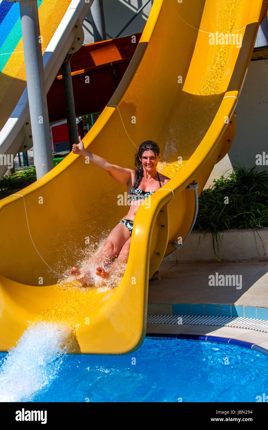 Woman on water slide aqua hi-res stock photography and images - Alamy
