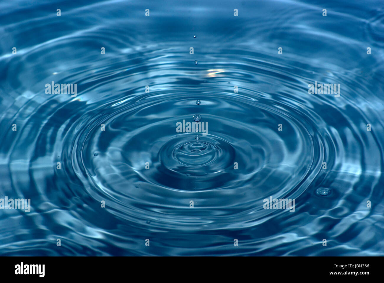 The round transparent drop of water falls downward Stock Photo - Alamy