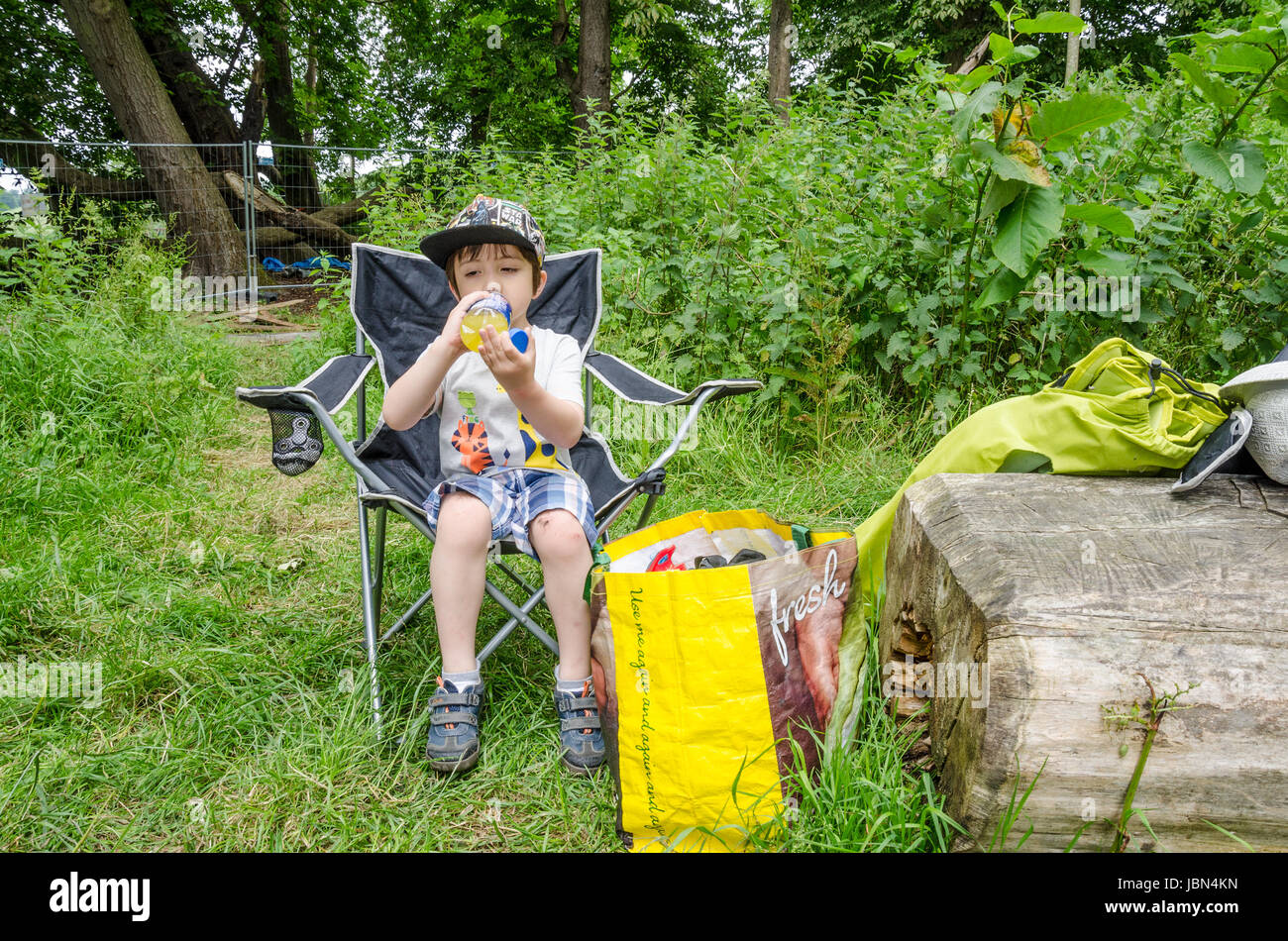 Boy Sat Down On Chair Stock Photos & Boy Sat Down On Chair Stock Images ...