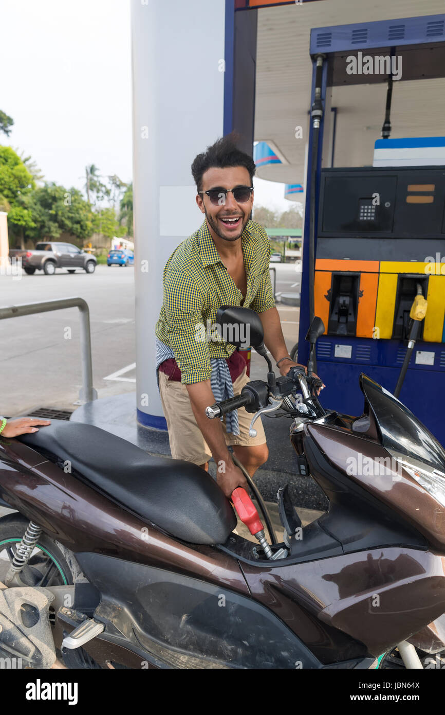 Man Fuel Motor Bike, Happy Smiling Hispanic Guy On Gas Station Stock ...