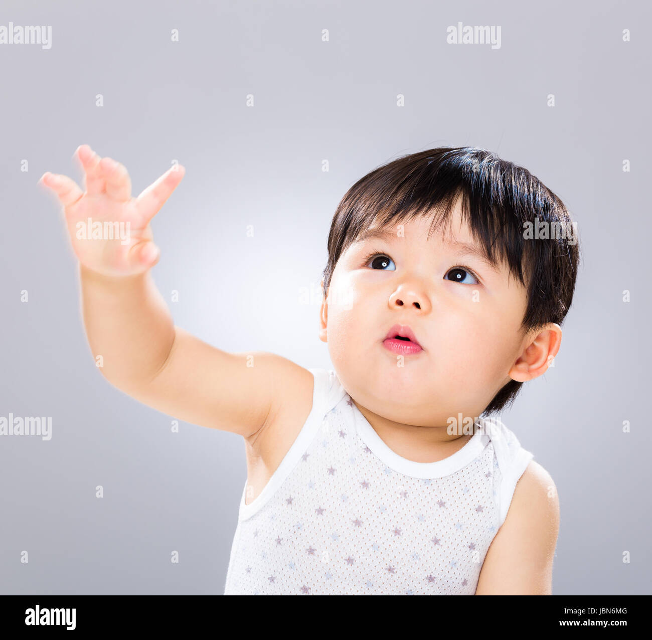 Baby boy hand raise up Stock Photo - Alamy