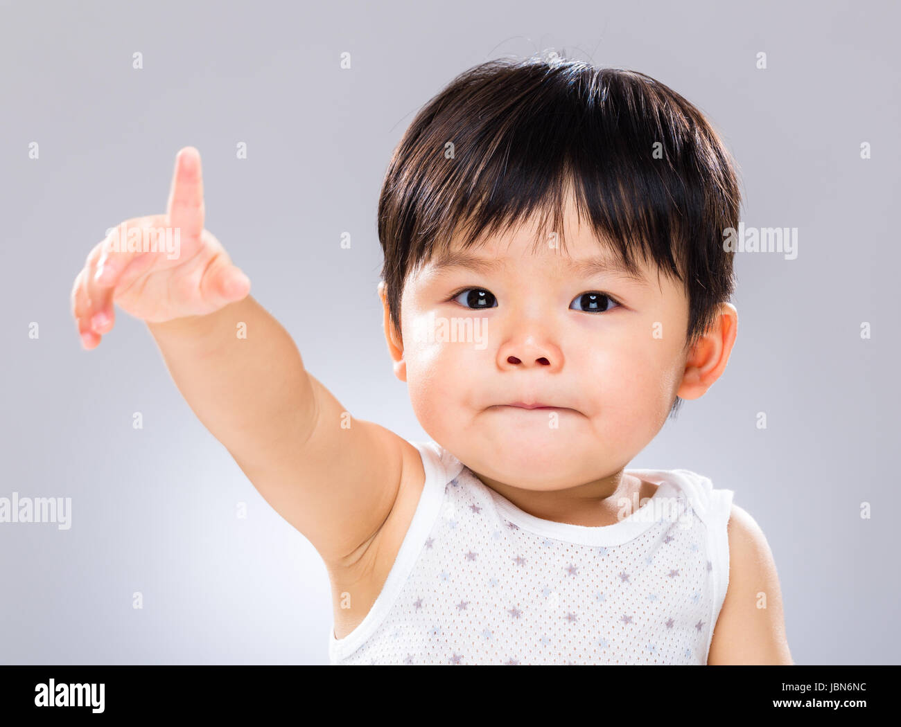 Baby hand raised up Stock Photo - Alamy