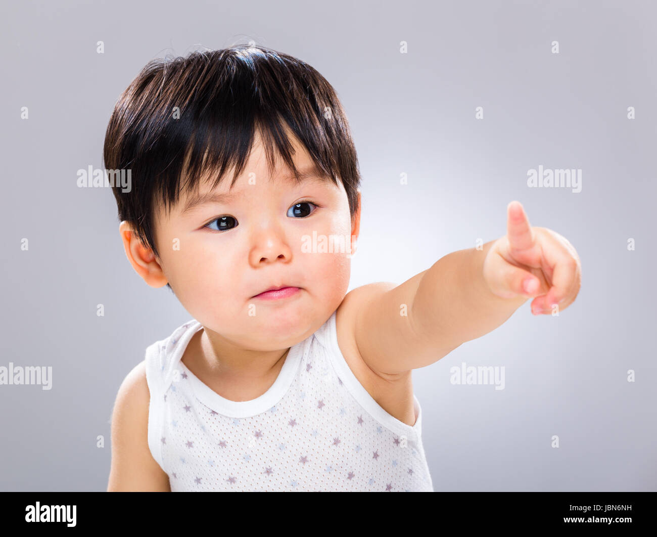 Baby boy pointing finger Stock Photo - Alamy
