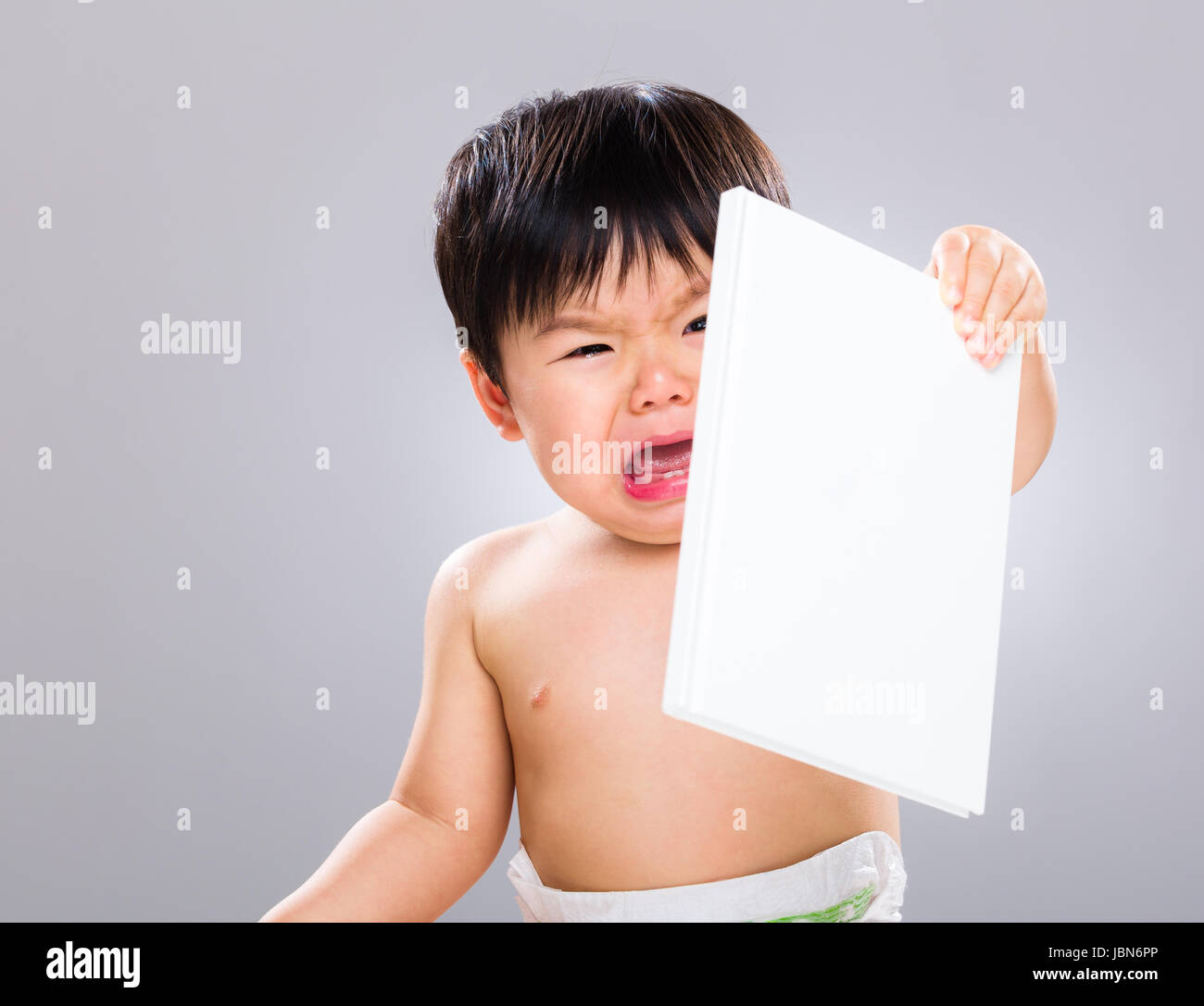 Little boy hate book Stock Photo - Alamy