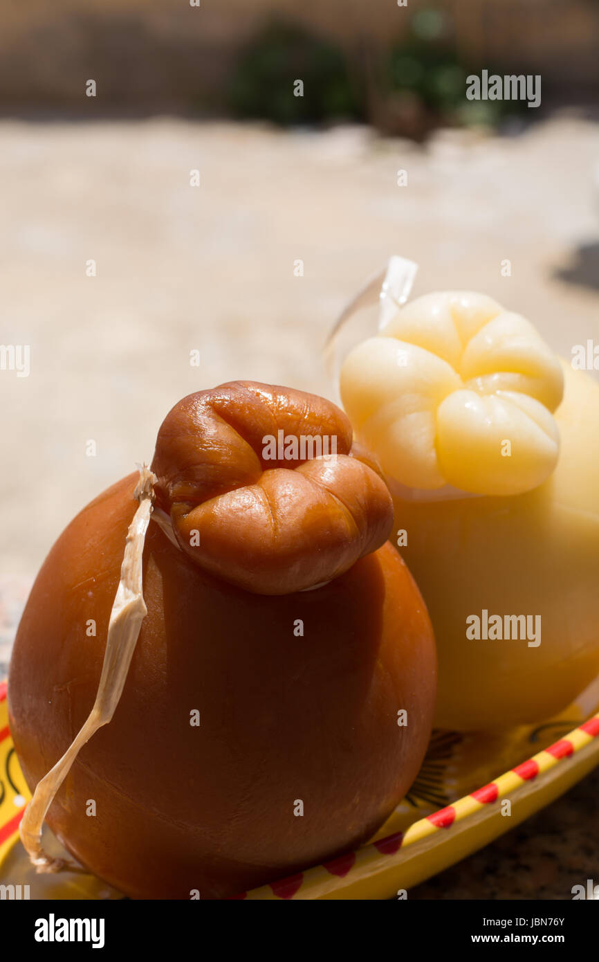 Traditional Italian hard cheese Provolone of Caciocavallo, white and ...