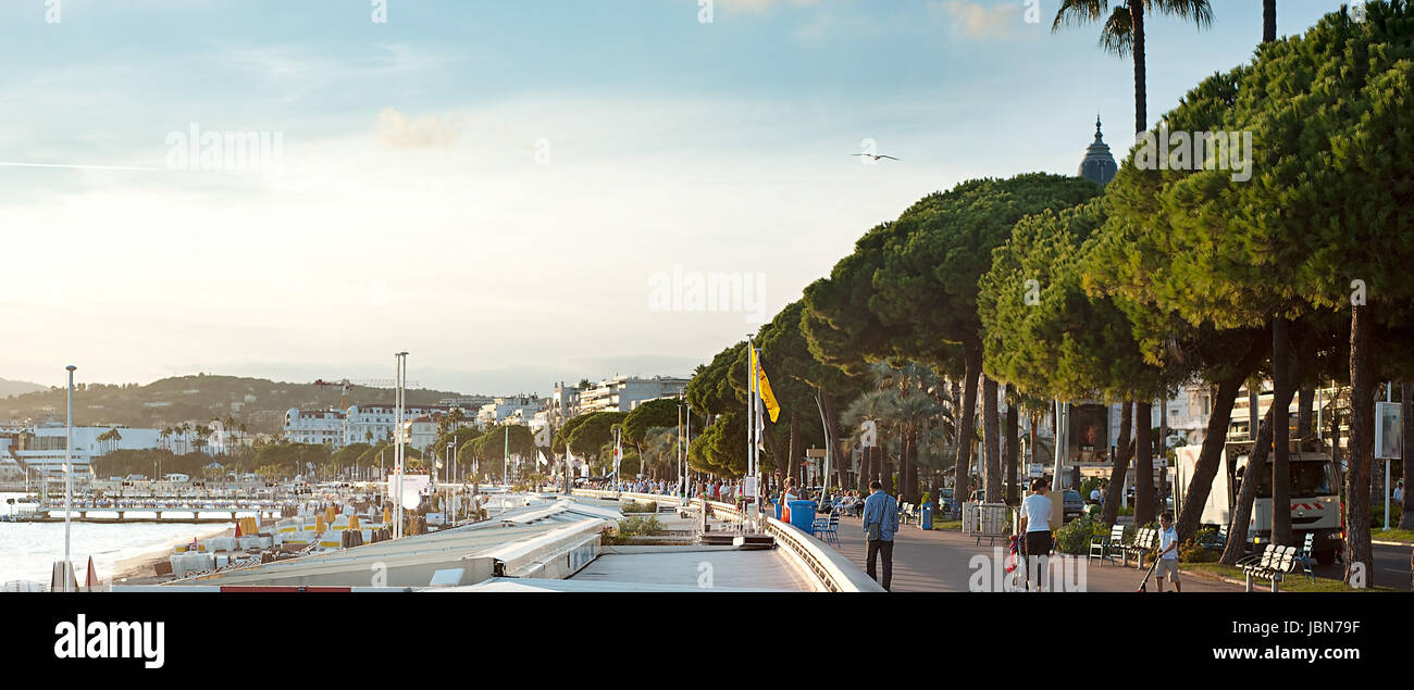 CANNES, FRANCE - SEPT 15, 2013: People walking at embankment of Cannes ...
